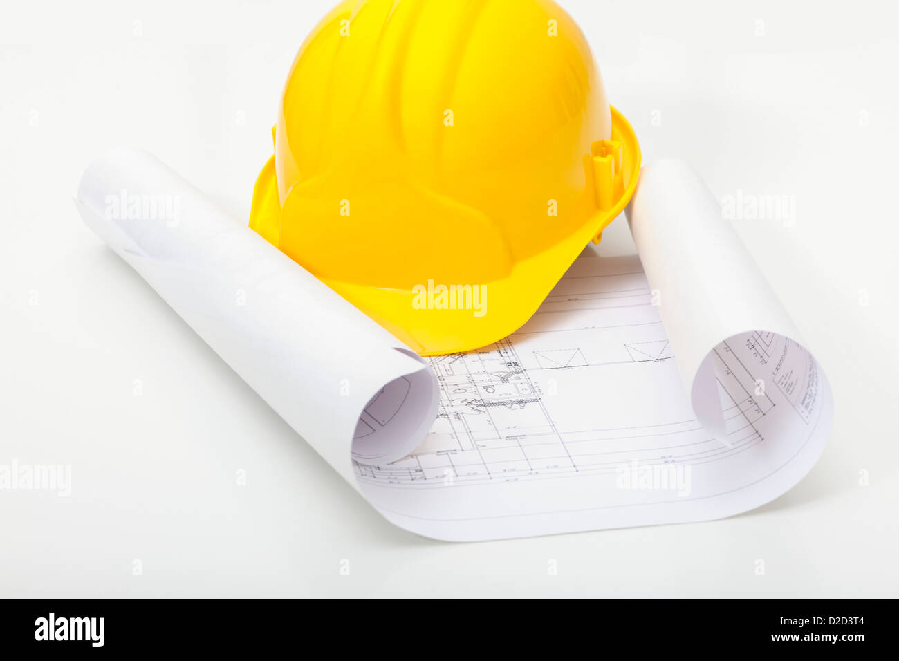 Hard hat and building plans Stock Photo - Alamy