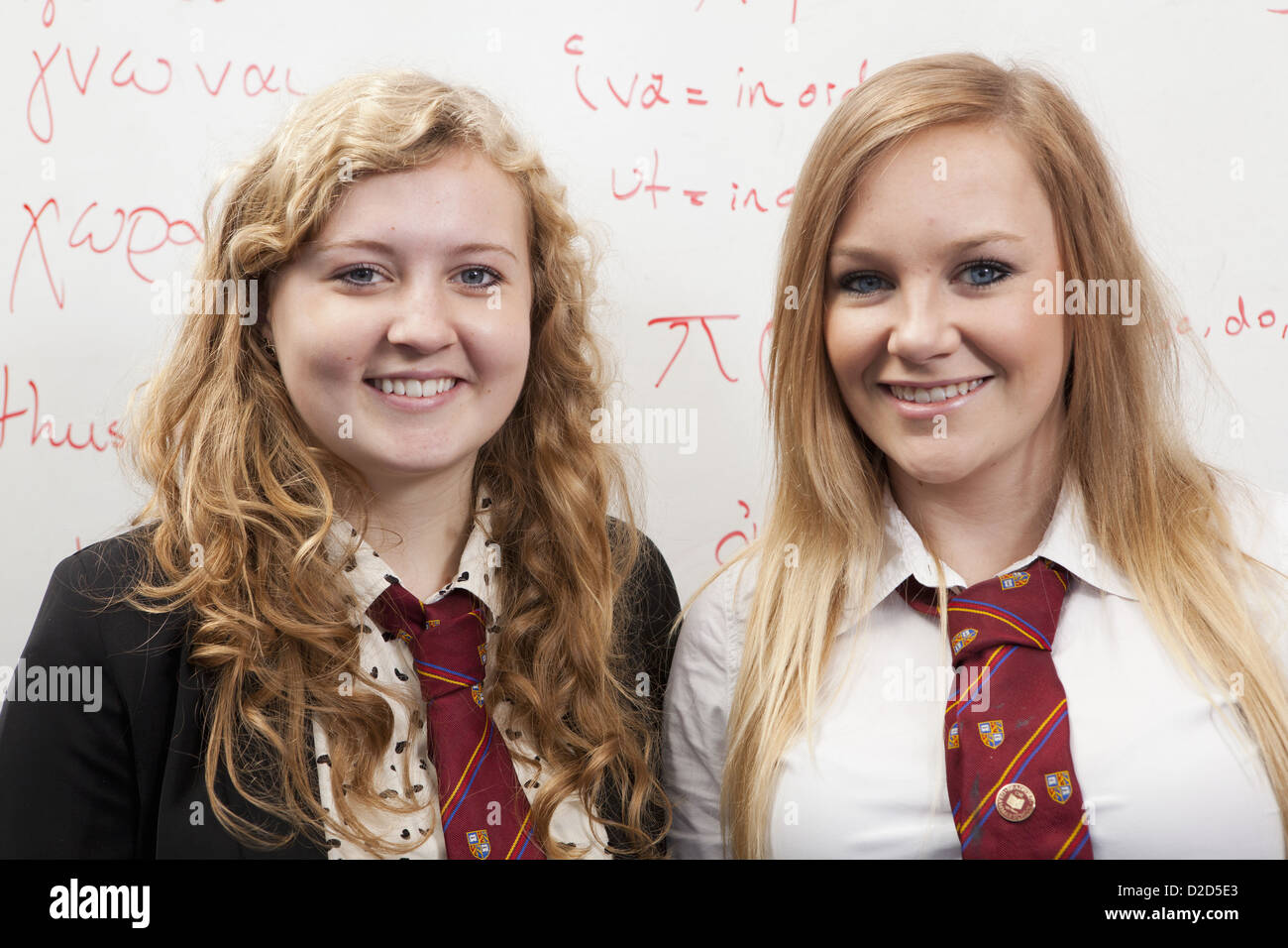 Students smiling at whiteboard in class Stock Photo - Alamy