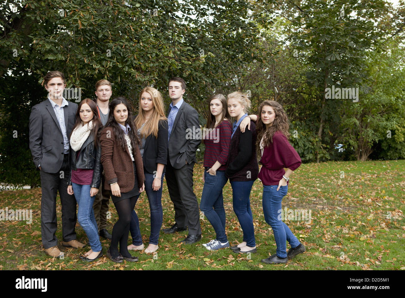 Students standing together in park Stock Photo - Alamy