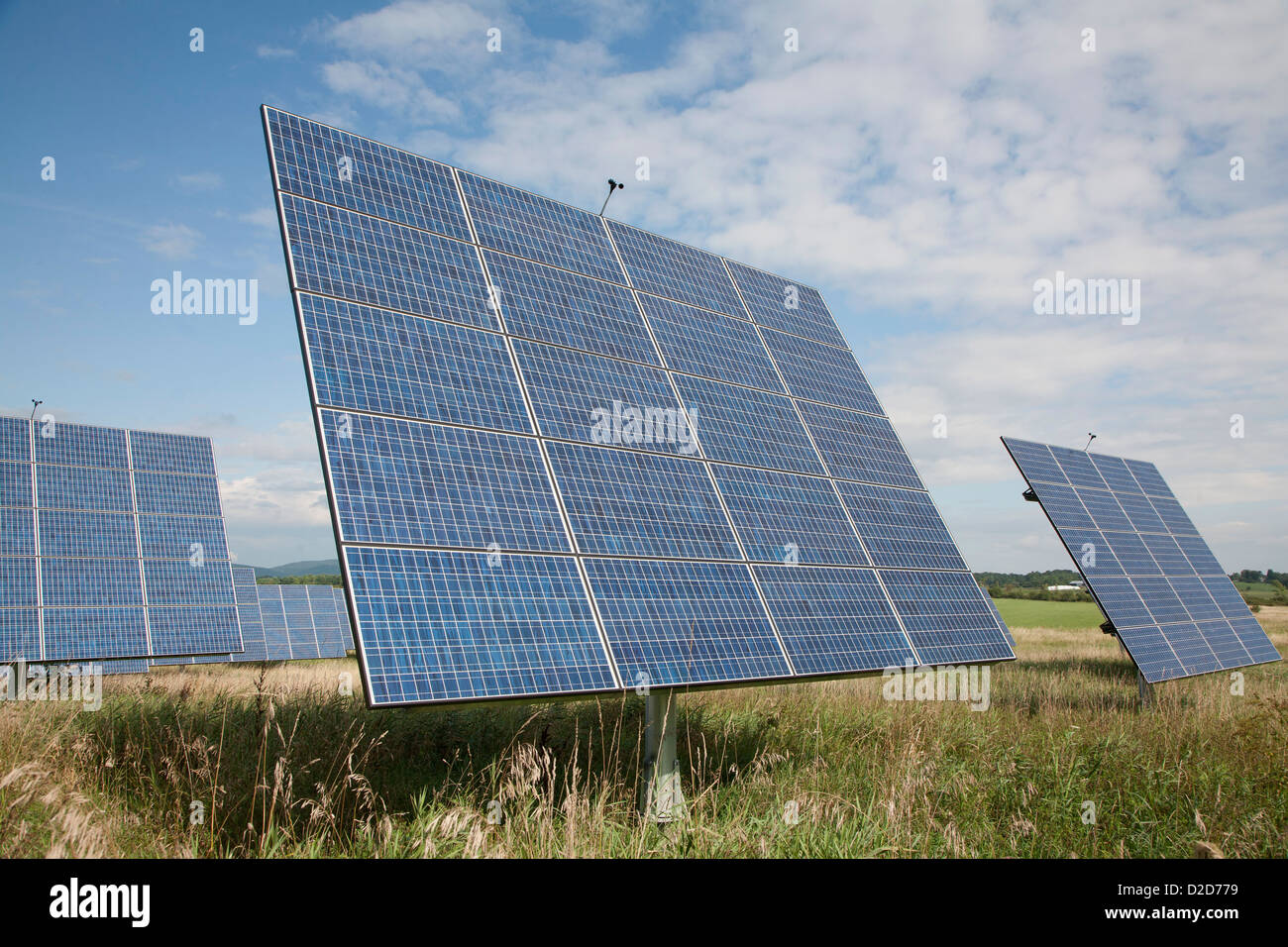 Solar panels in a field Stock Photo - Alamy
