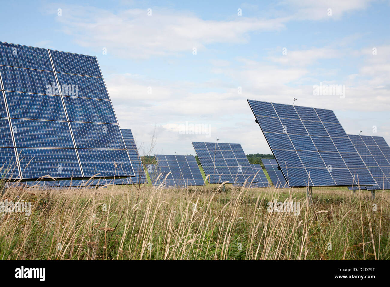 Solar panels in a field Stock Photo - Alamy