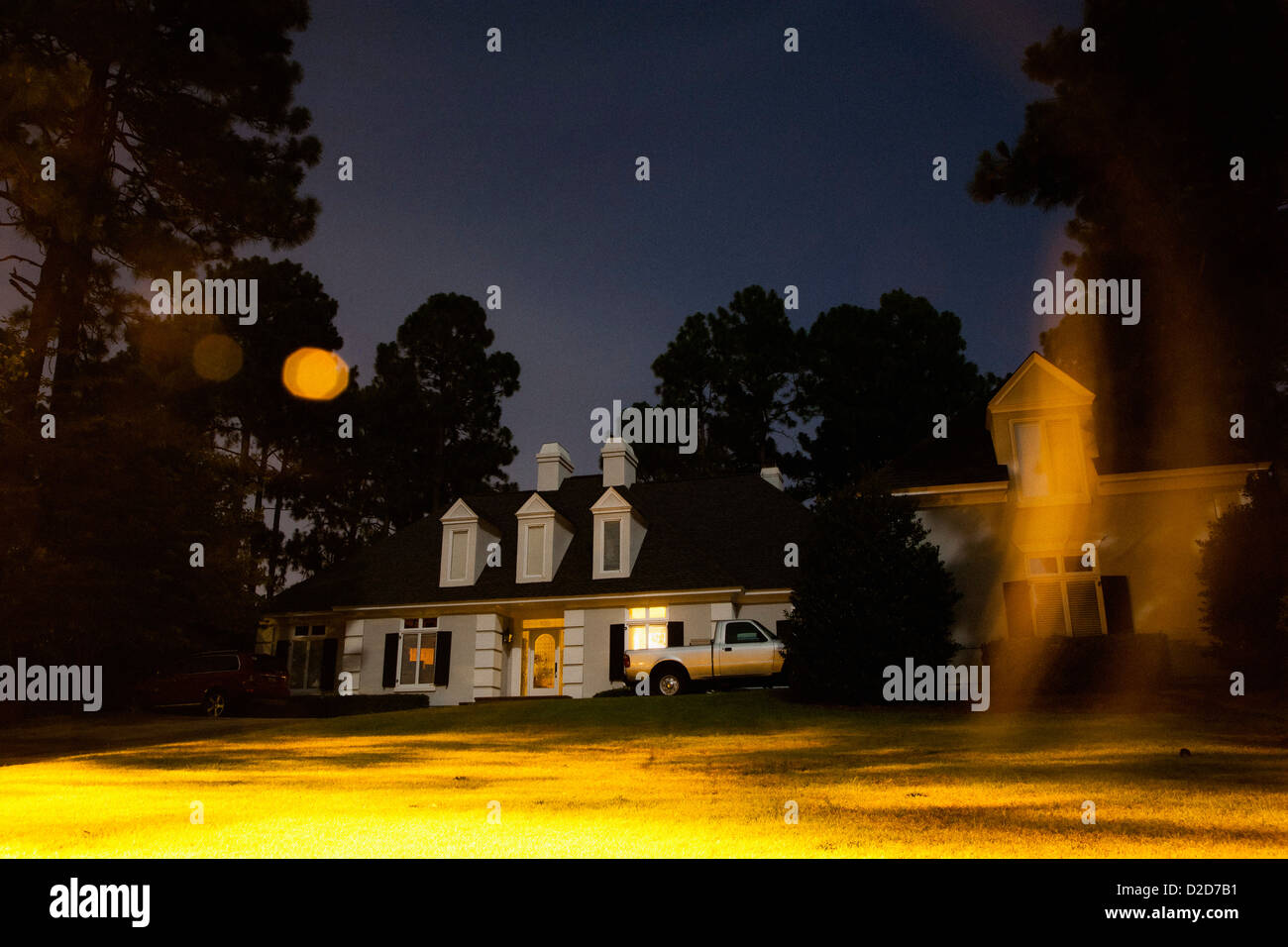 An illuminated house at night, long exposure Stock Photo - Alamy
