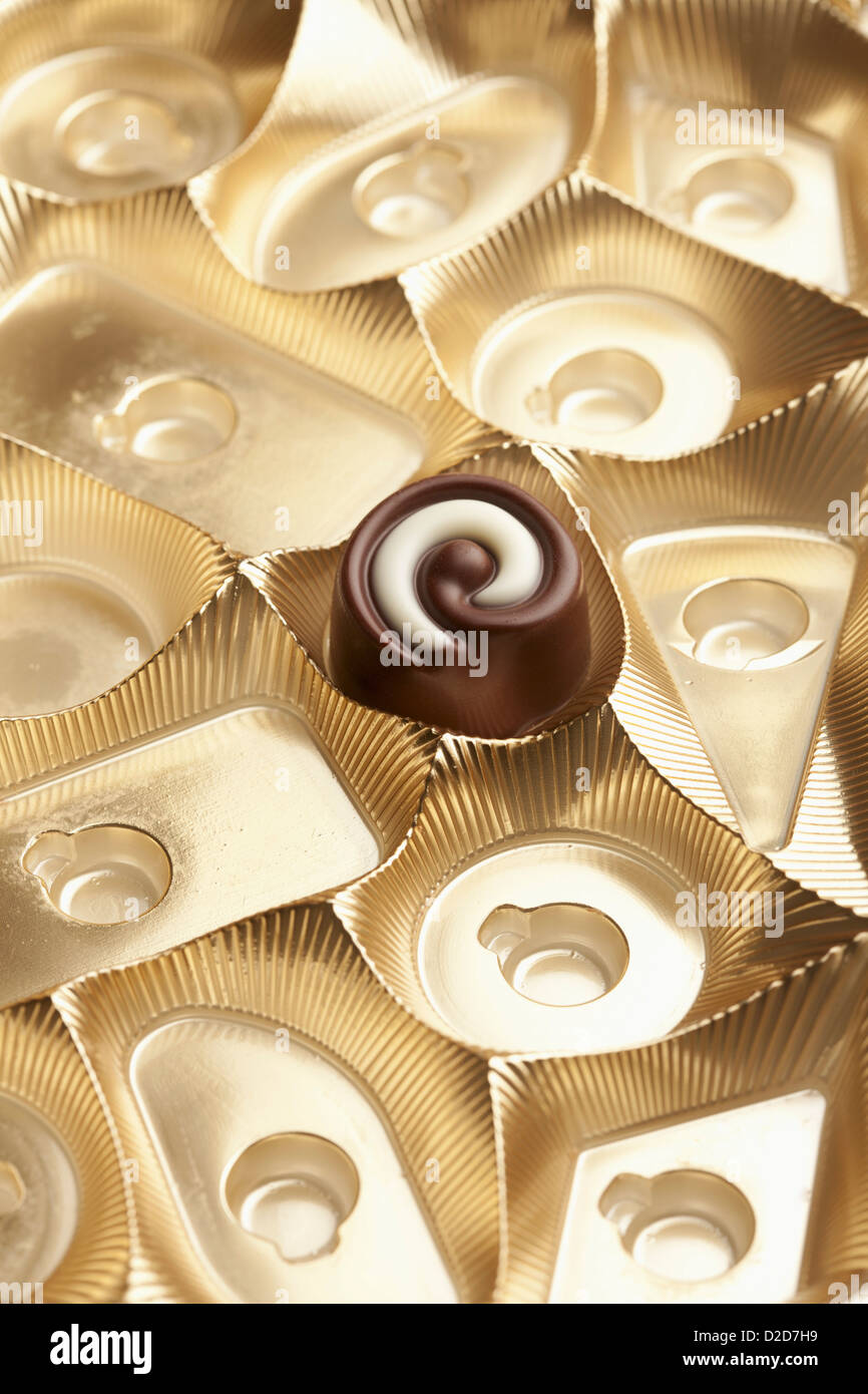 A single chocolate in a box Stock Photo - Alamy