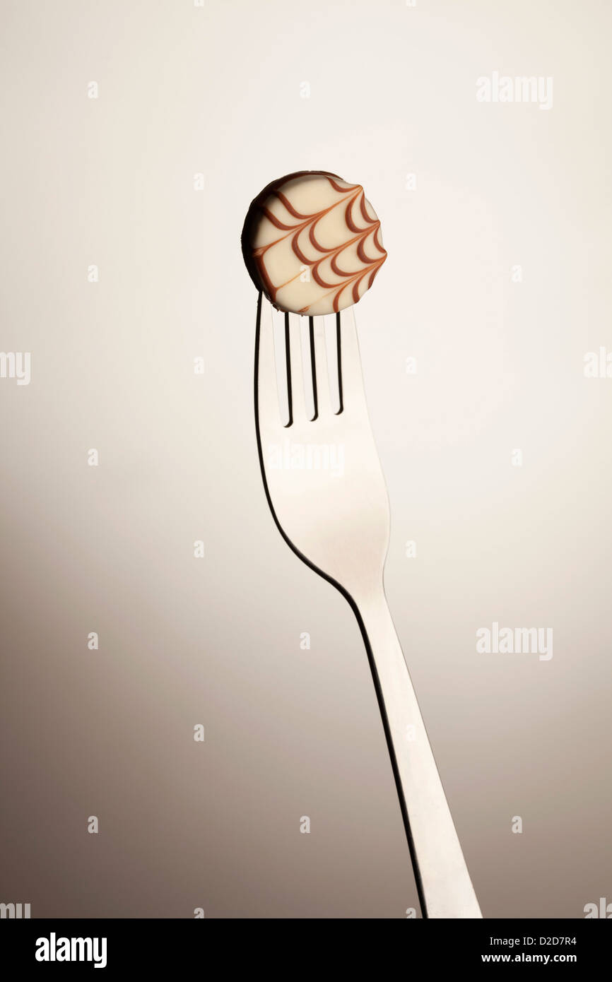 Candy treat on fork Stock Photo - Alamy