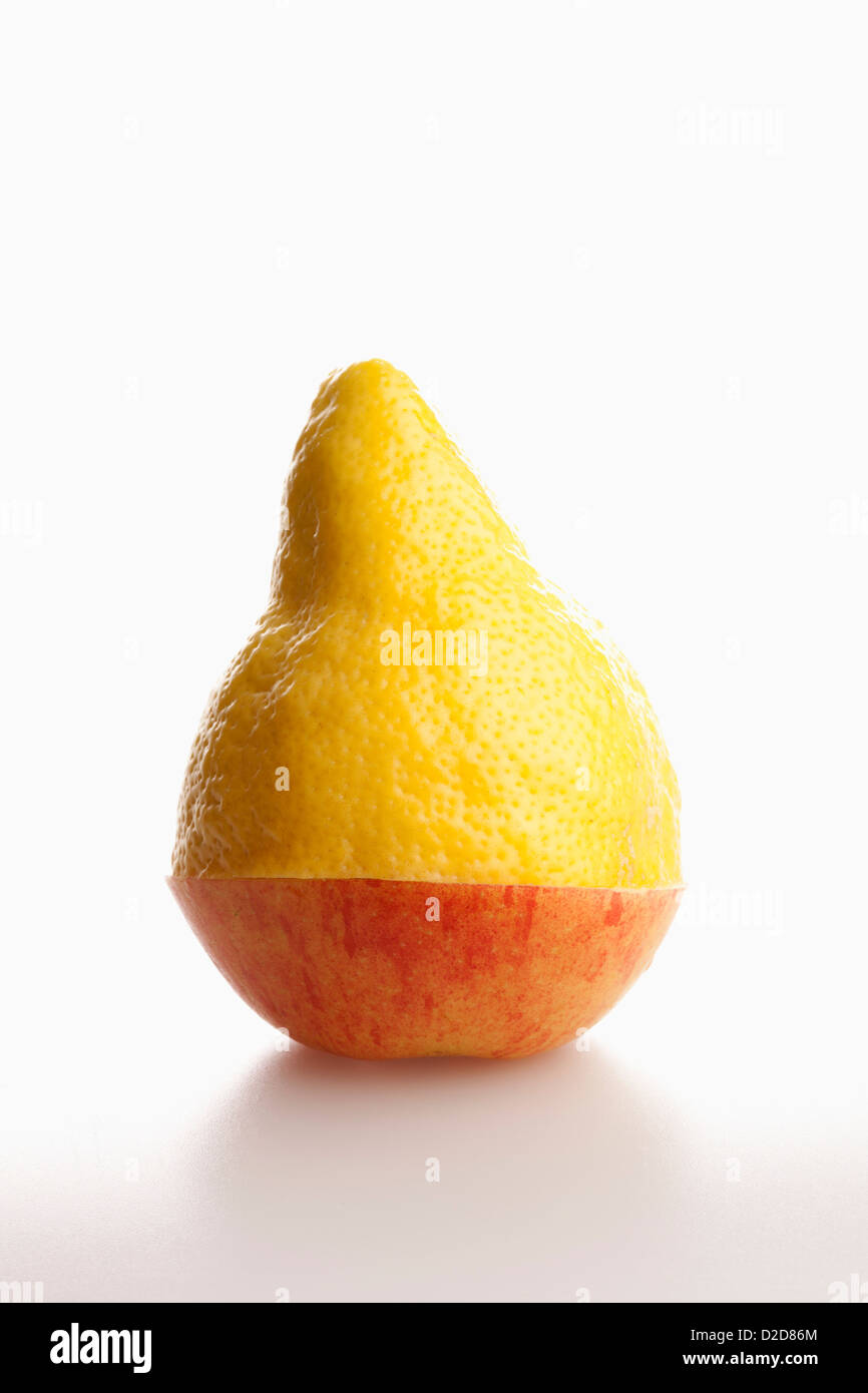 Two pieces of different fruit stacked to comprise the shape of a piece ...