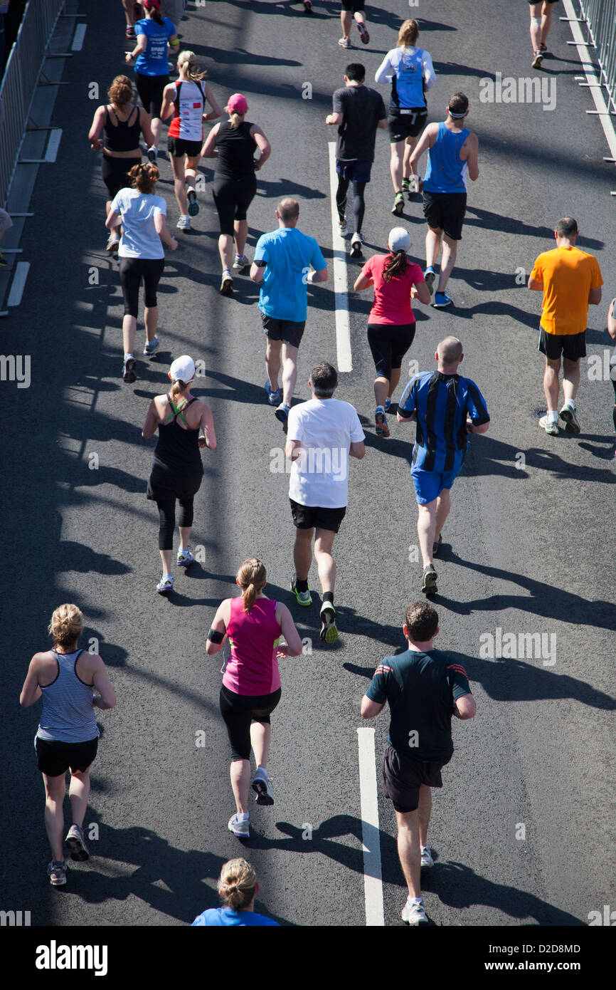 Rear view of people running in a marathon Stock Photo - Alamy