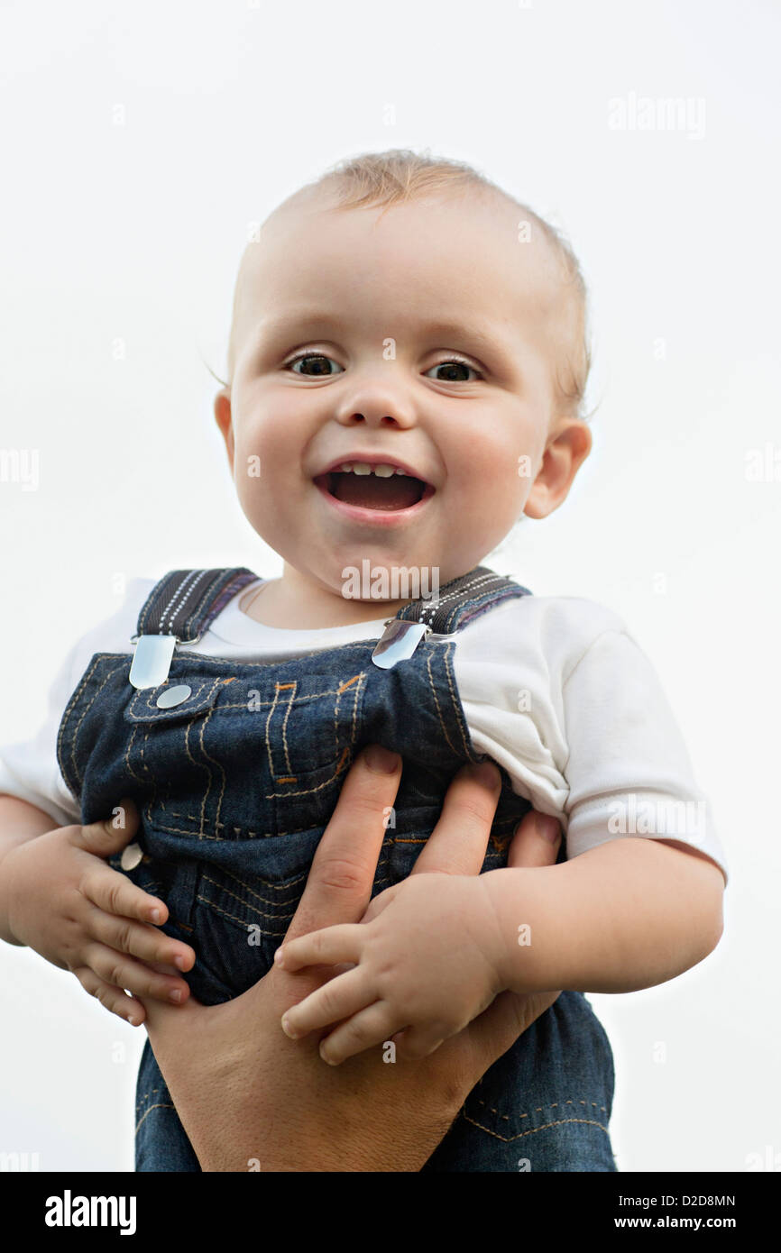 Baby held up high Stock Photo - Alamy