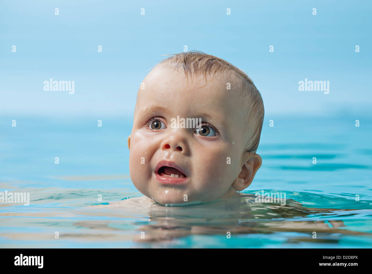 Baby in water Stock Photo - Alamy