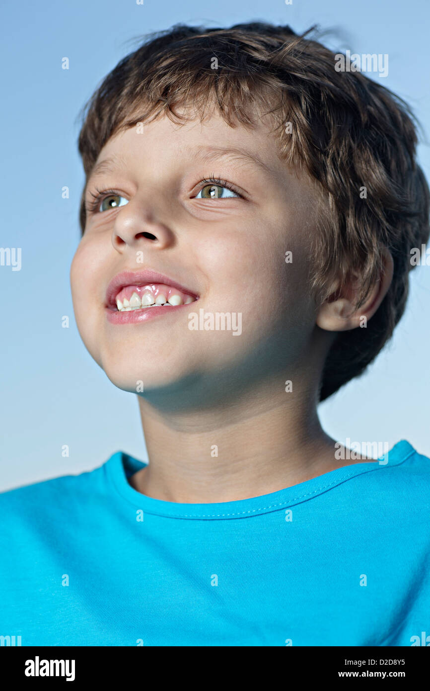A boy looking off camera with excitement Stock Photo - Alamy