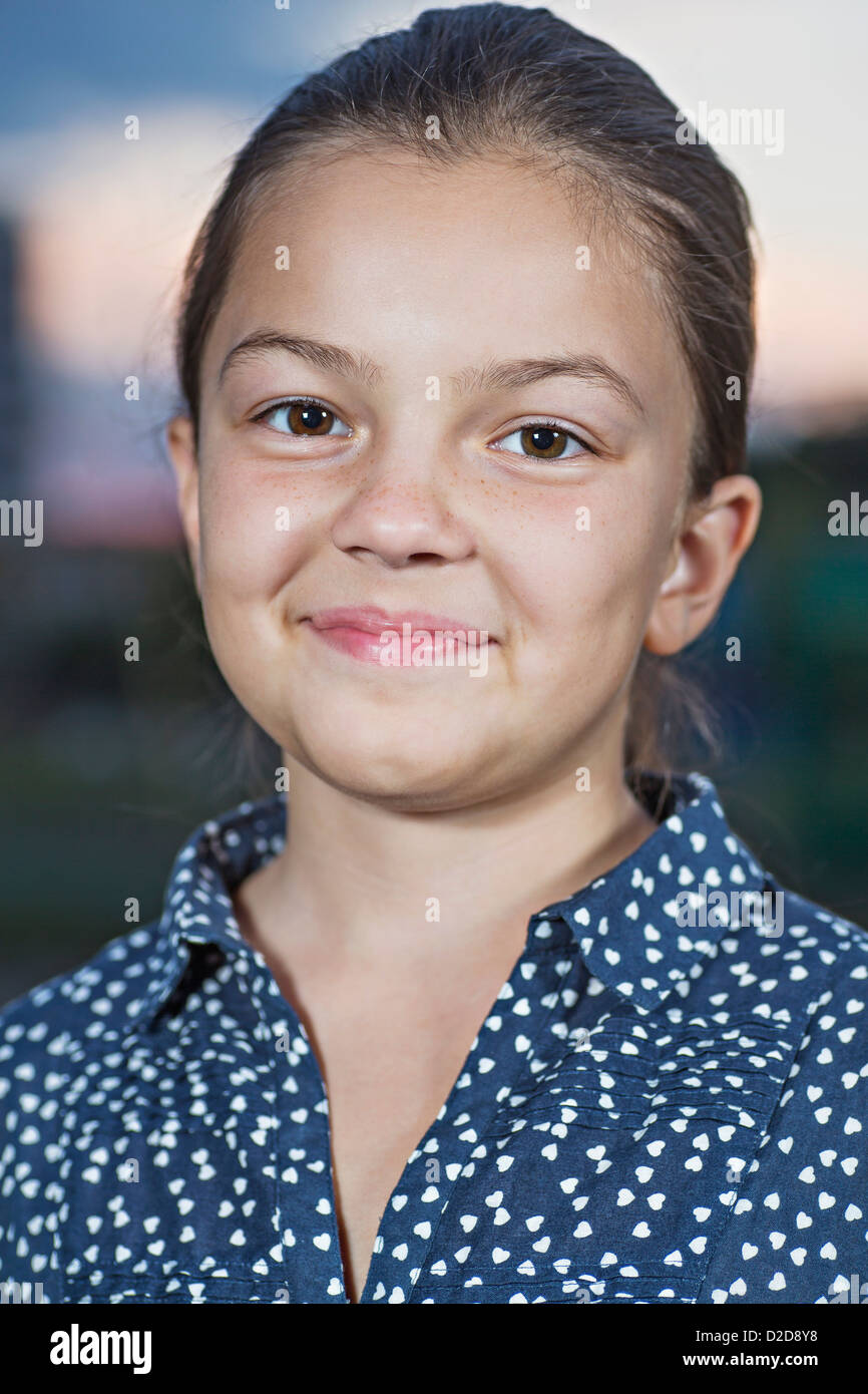 A girl smiling and looking into the camera Stock Photo - Alamy