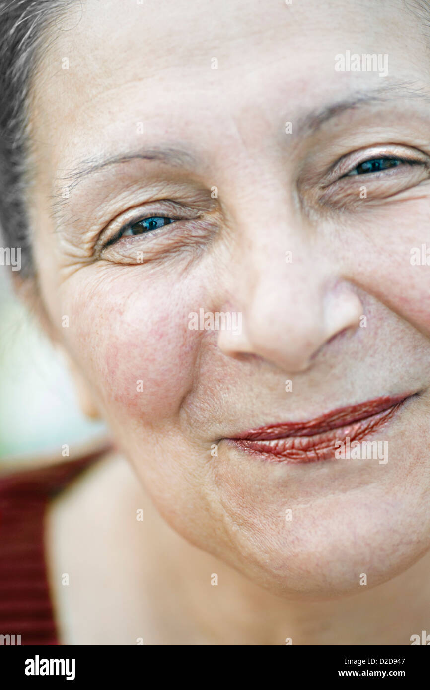 A mature woman smiling cheerfully, close-up Stock Photo - Alamy