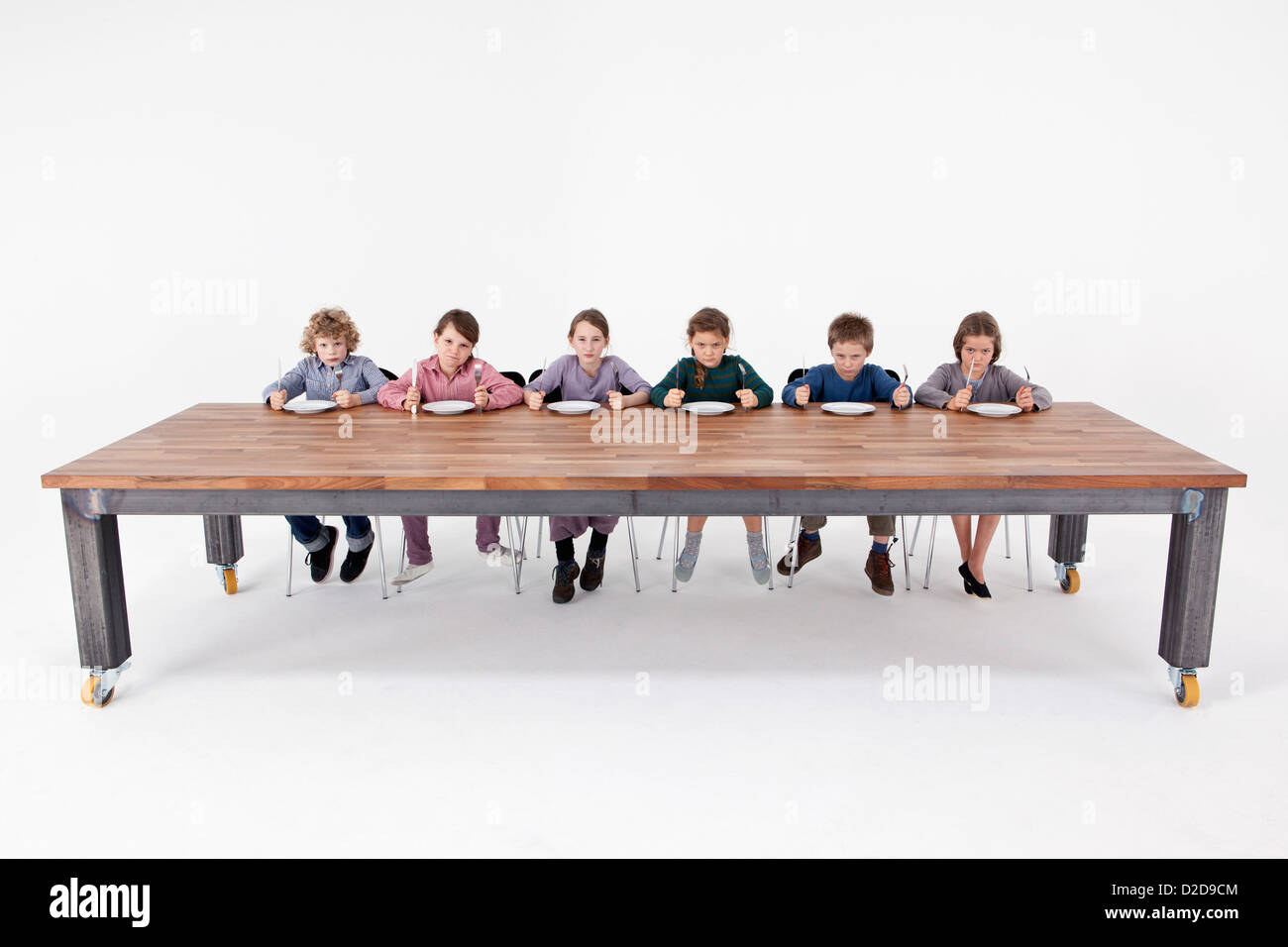 Six angry kids holding knives and forks impatiently waiting for food ...