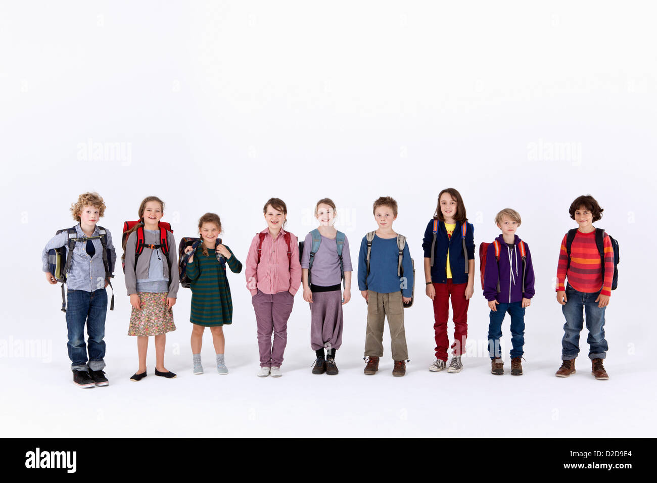 Group school children wearing backpacks hi-res stock photography and ...