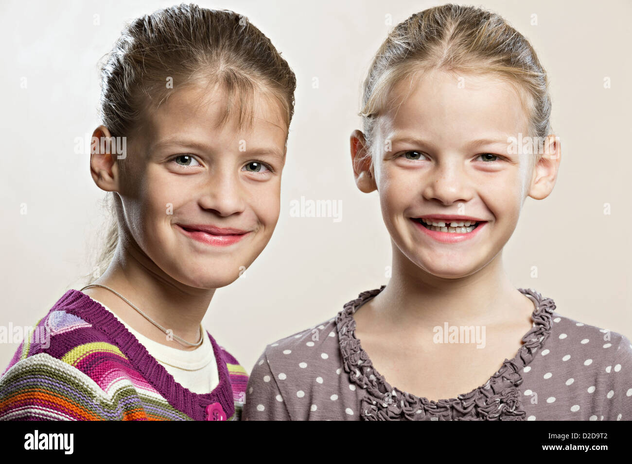 Fraternal twins smiling into the camera Stock Photo - Alamy