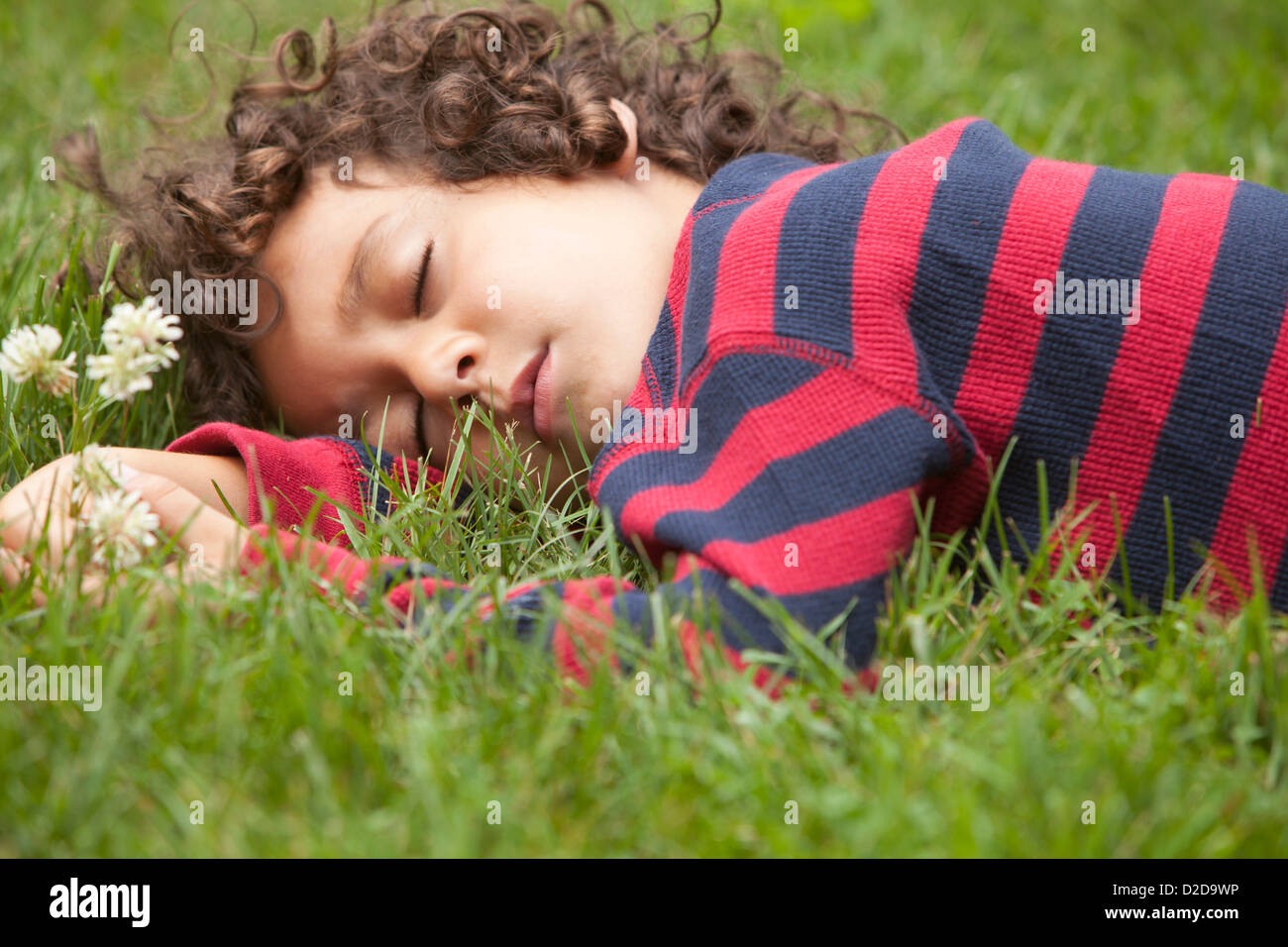 Child sleeping on lawn hi-res stock photography and images - Alamy