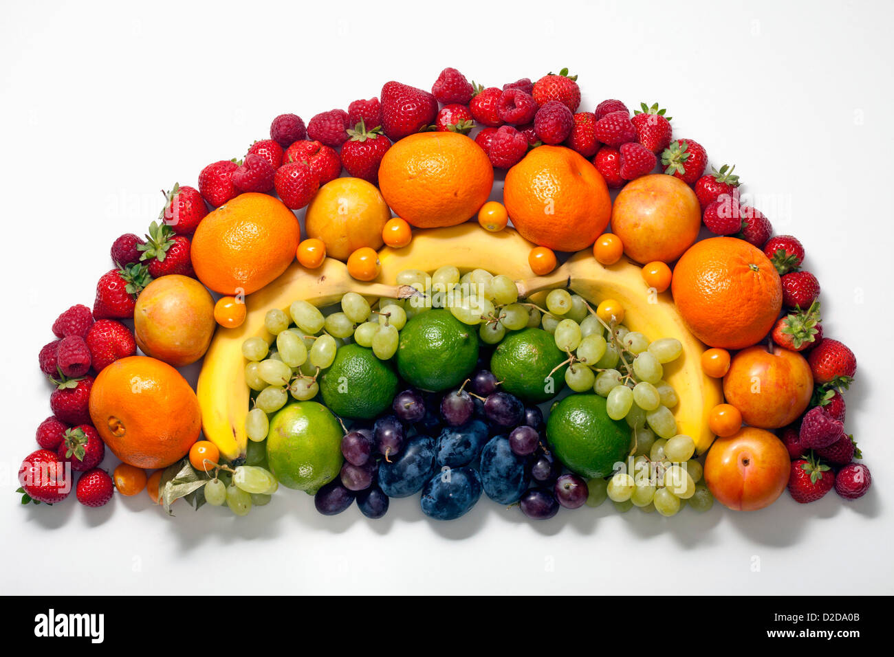 Various fruits arranged into the shape of a rainbow Stock Photo - Alamy