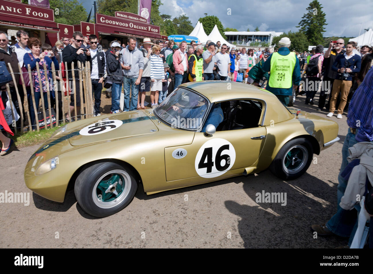 1965 Lotus Elan 26R makes it's way through the paddock at the 2012 ...