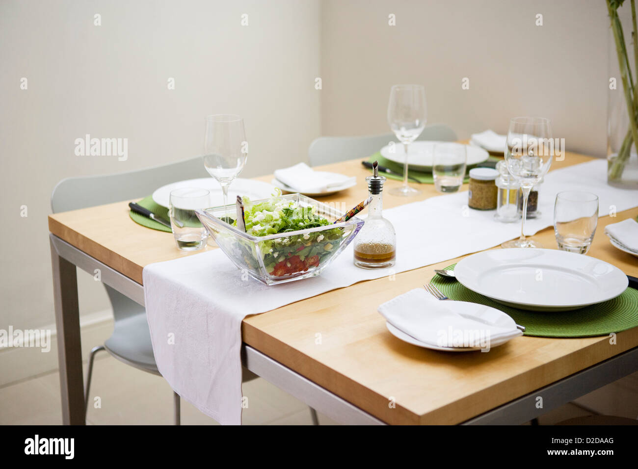Salad bowl on dining table Stock Photo - Alamy