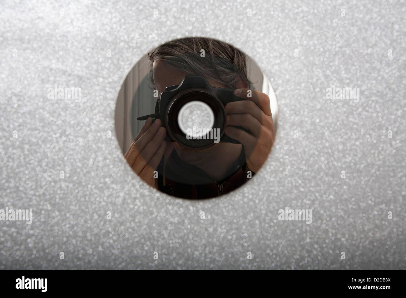 CD reflecting photographer Stock Photo - Alamy