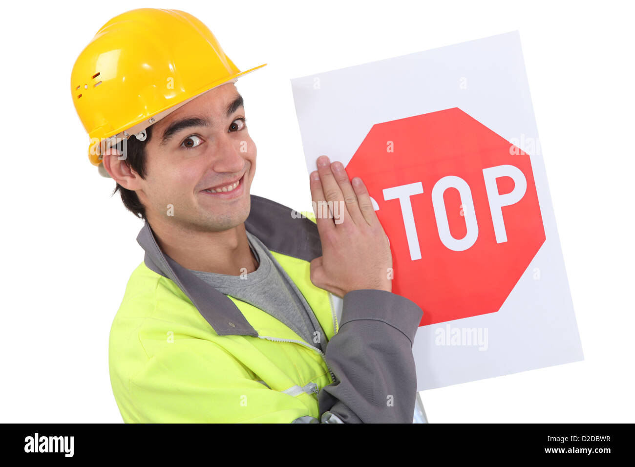 Road worker holding a stop sign Stock Photo - Alamy