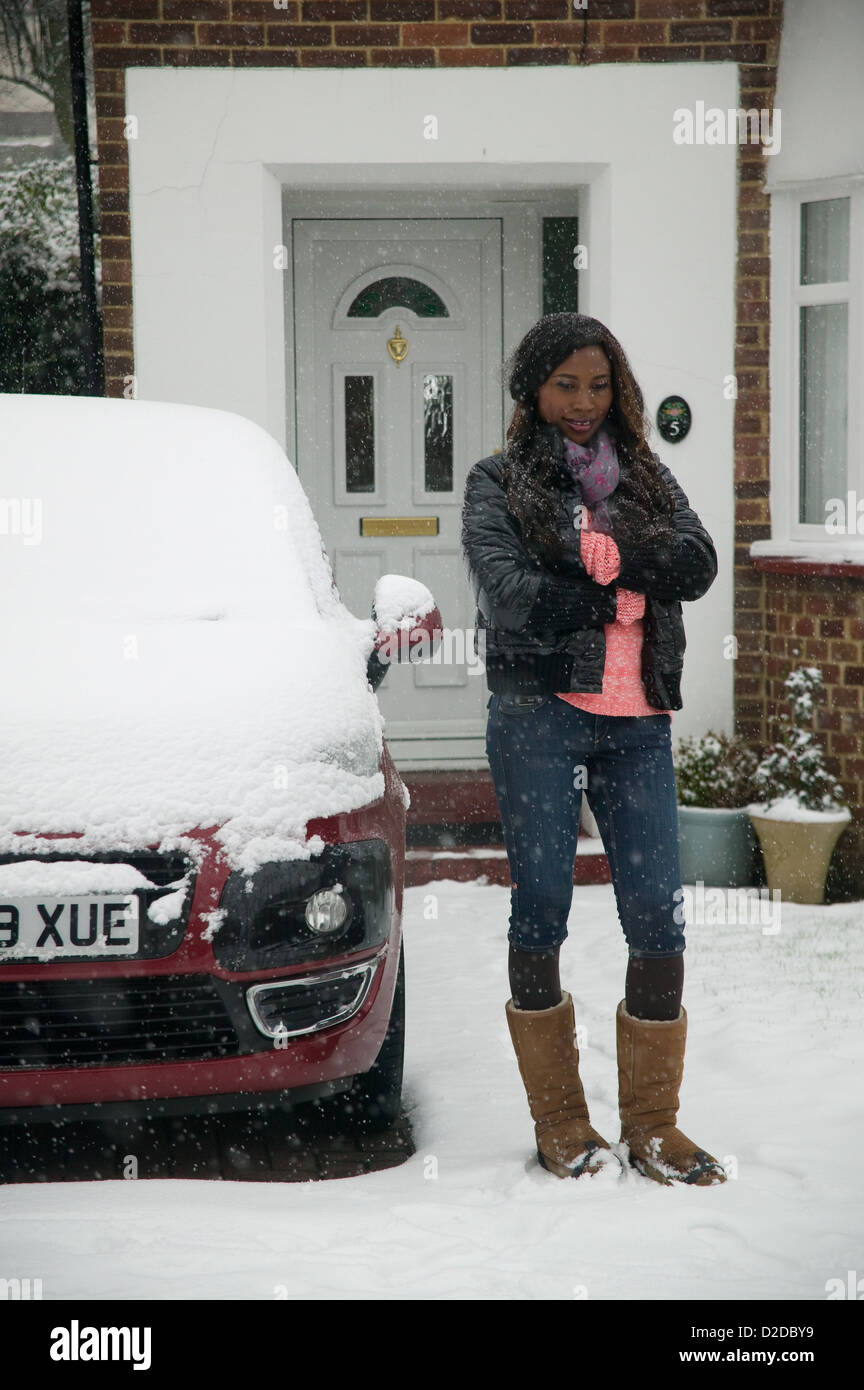 Nigerian Ebo African woman in snowing winter day Stock Photo - Alamy