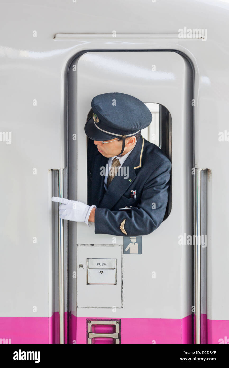 Japan, Honshu, Kanto, Tokyo, Tokyo Station, Train Guard and Door of ...