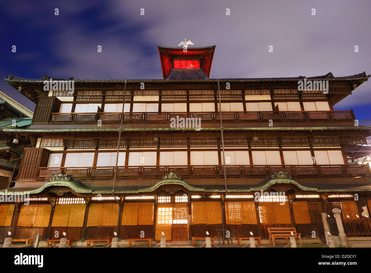 Dogo Onsen and the cityscape of Matsuyama, Japan. Dogo Onsen is one of ...