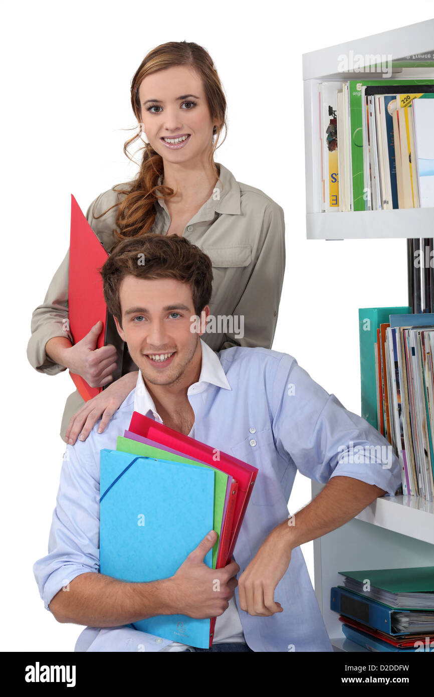 Young couple in library Stock Photo - Alamy