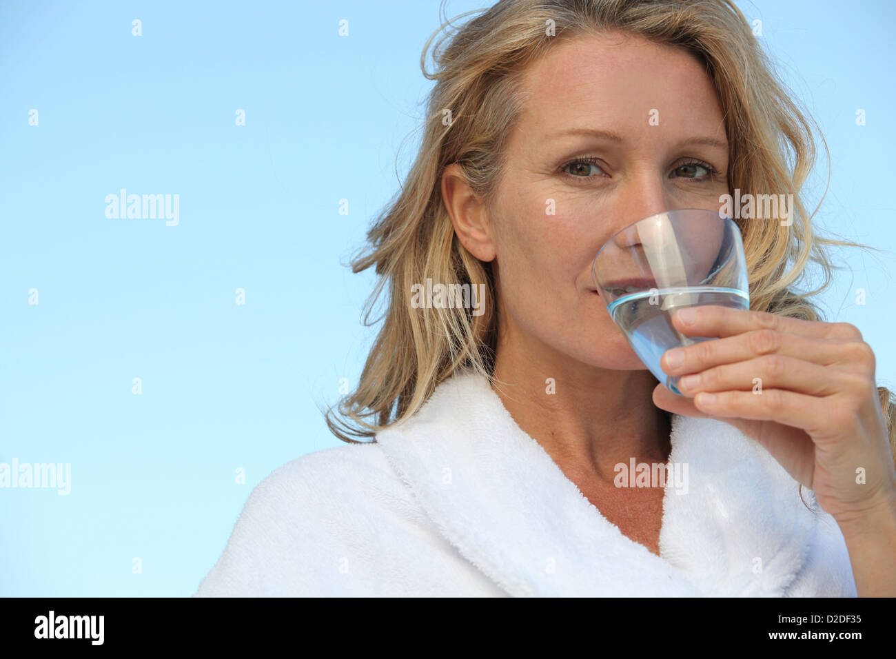Woman drinking glass water Stock Photo - Alamy