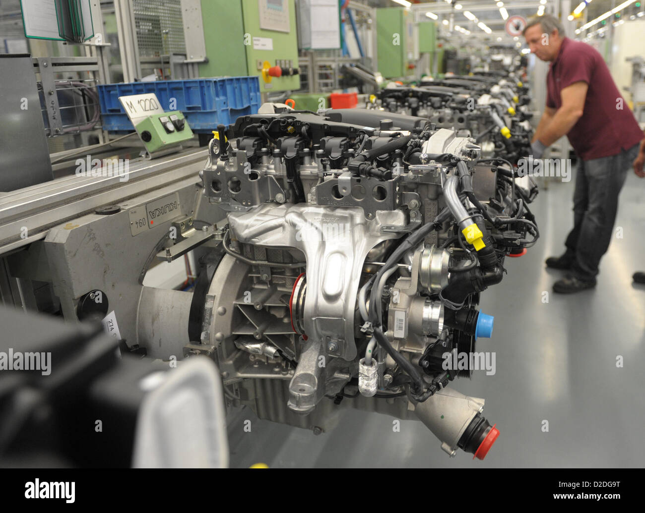 A Daimler employee is working on engines, on 20 September 2012, at the ...