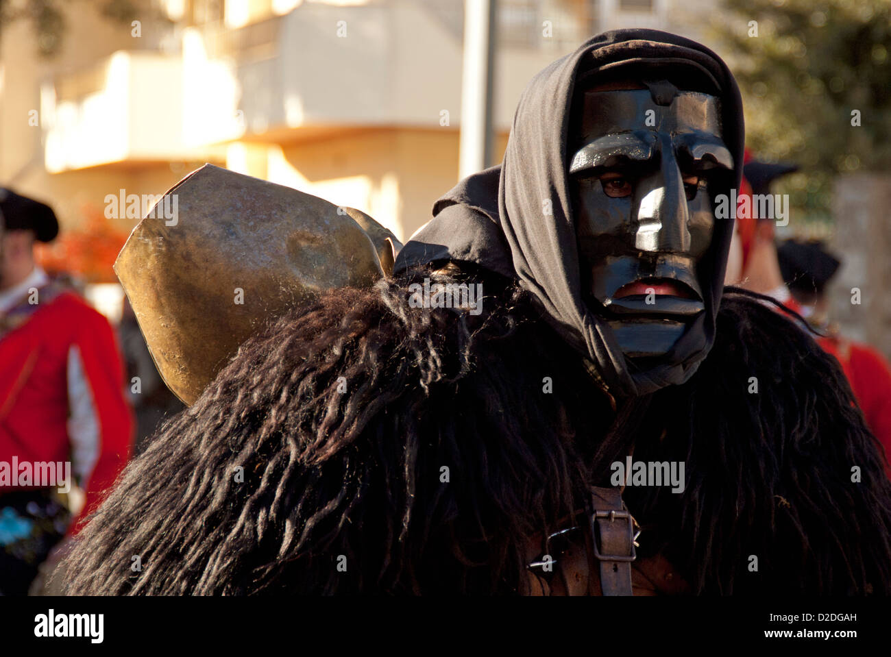 Mamuthones masks on the street at the Mamoiada traditional Carnival ...