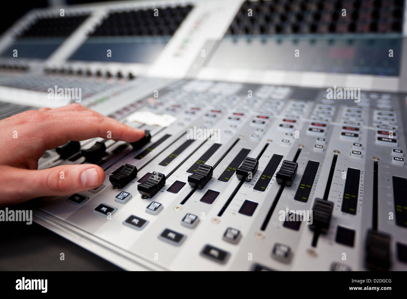 Close-up of a hand on a fader on a Television studio mixing desk Stock ...