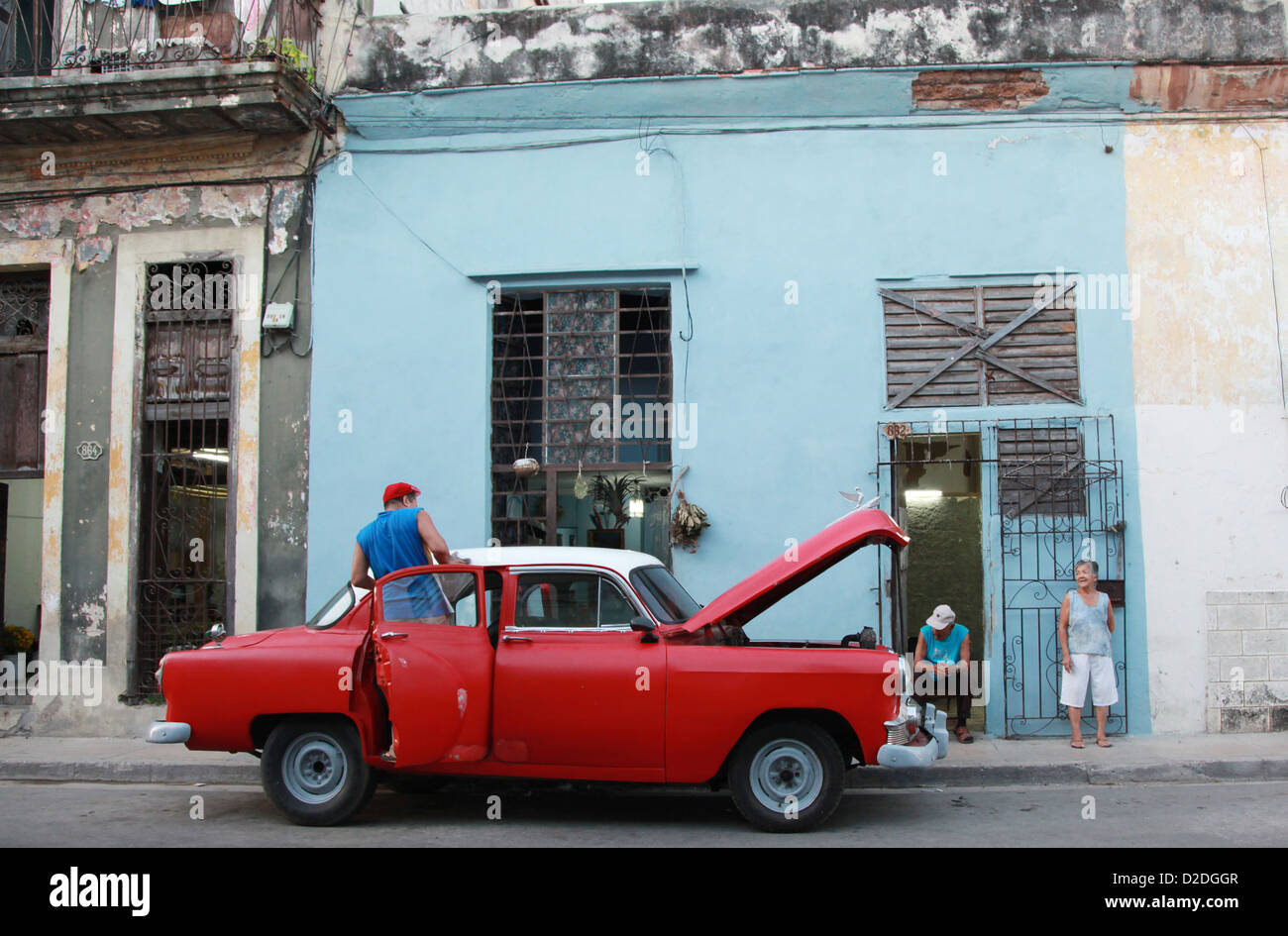 Street scene with old red car, Havana, Cuba Stock Photo - Alamy