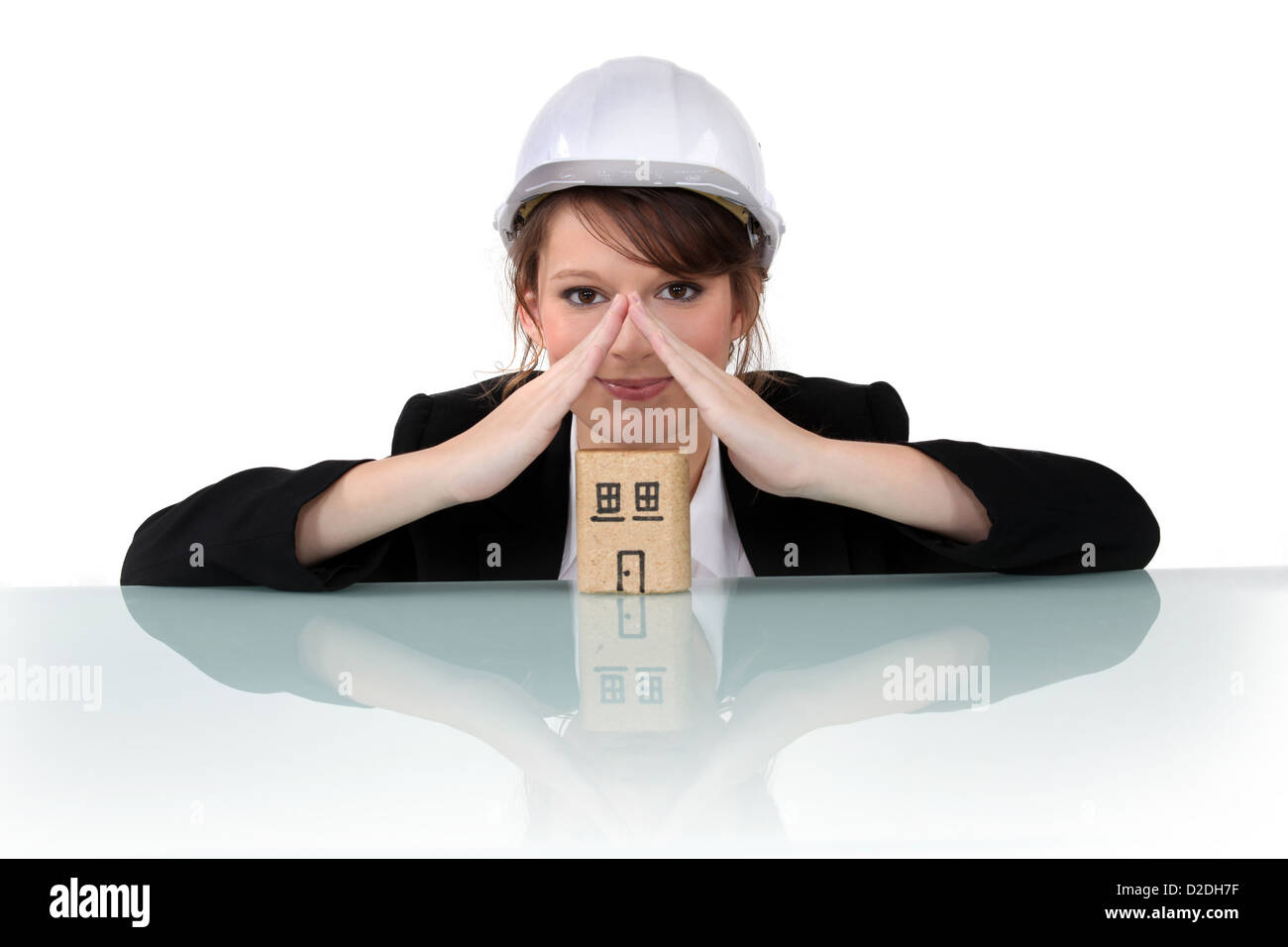 Woman with hands forming the roof of house Stock Photo - Alamy
