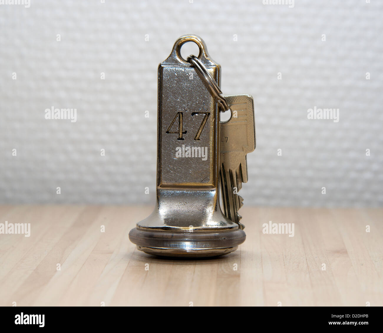 hotel key number forty seven on wooden table Stock Photo - Alamy