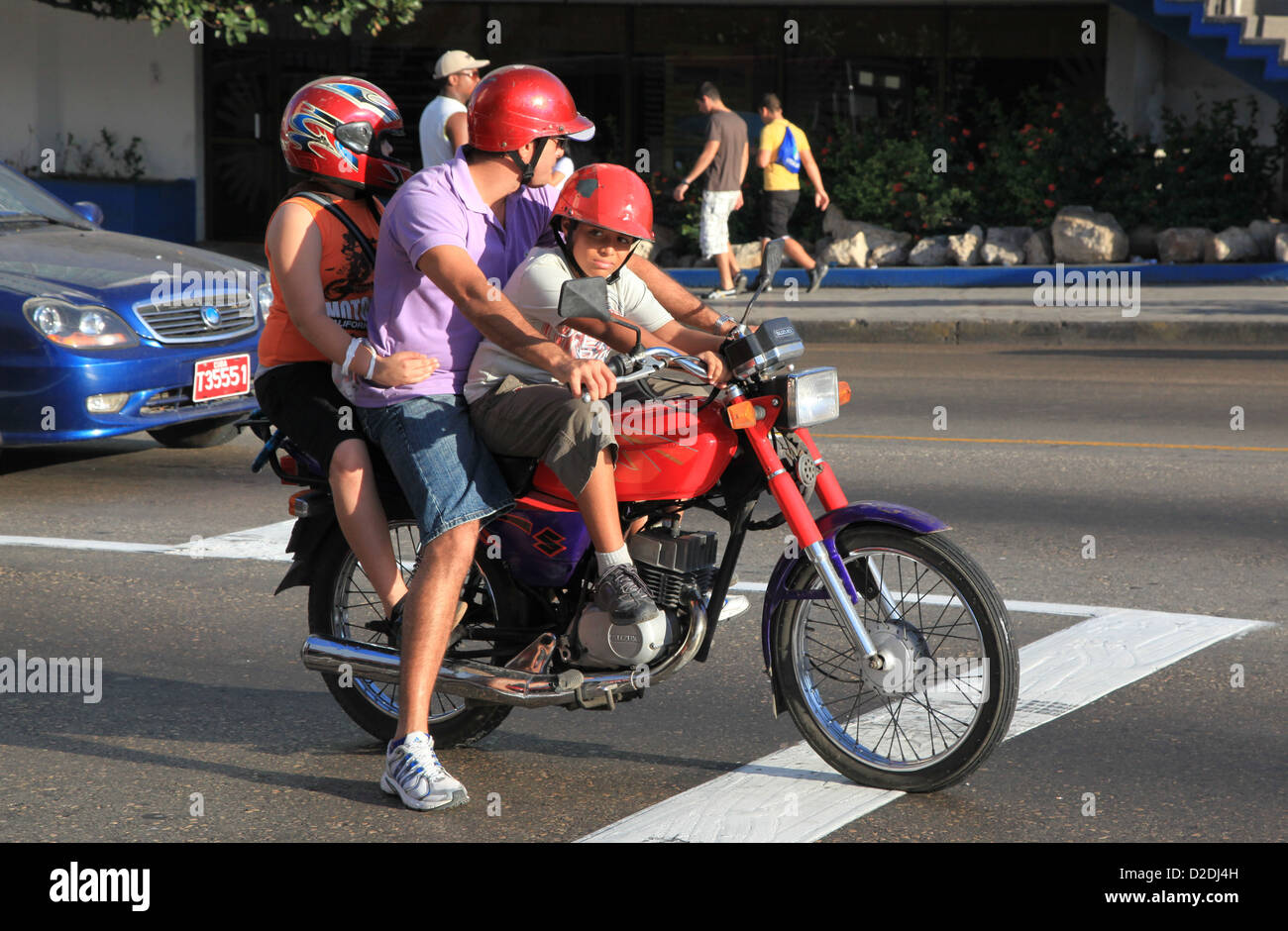 Family on a motorbike Stock Photo - Alamy