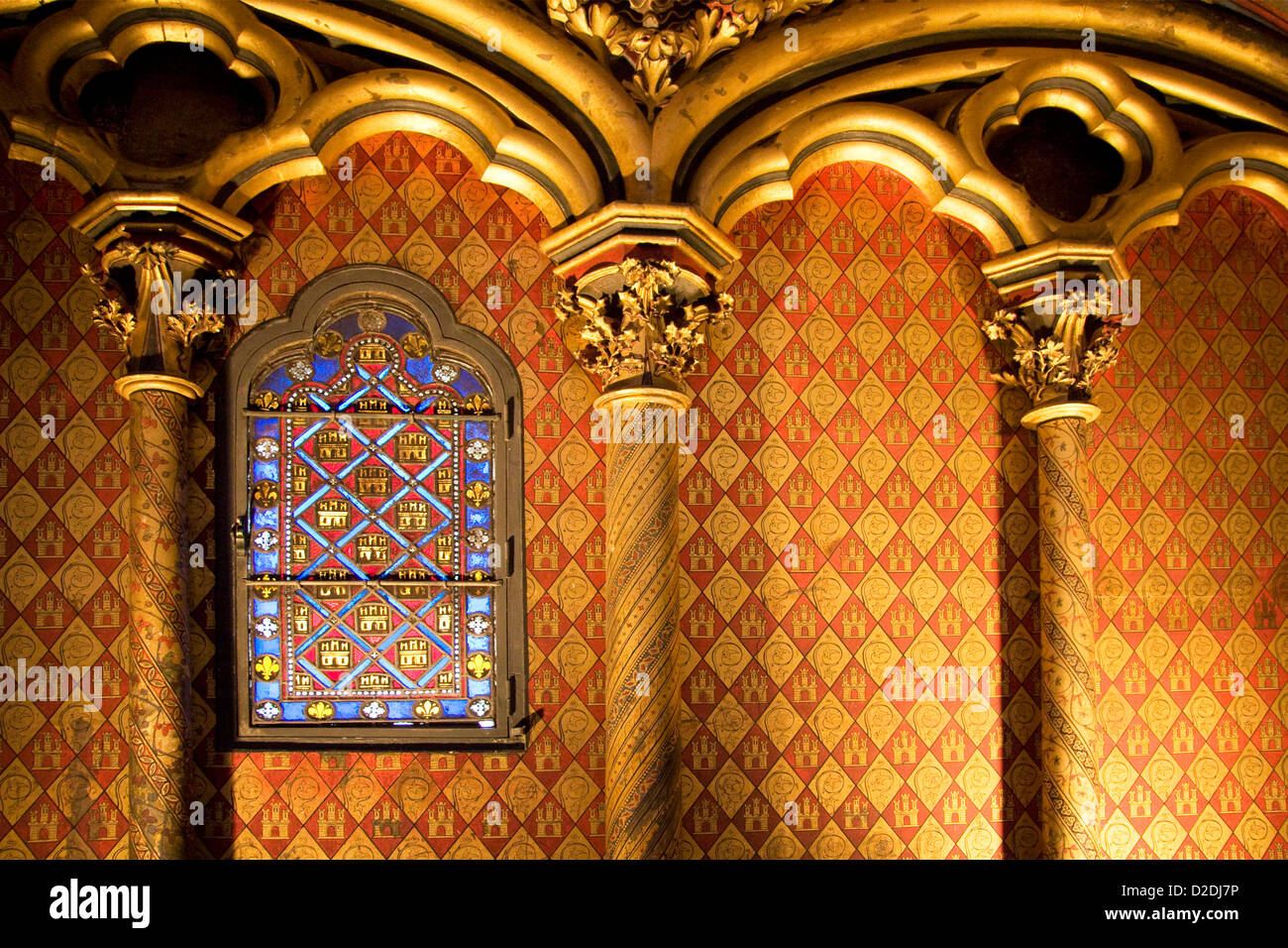 Foliated columns and a small stained glass window in the Upper Chapel ...