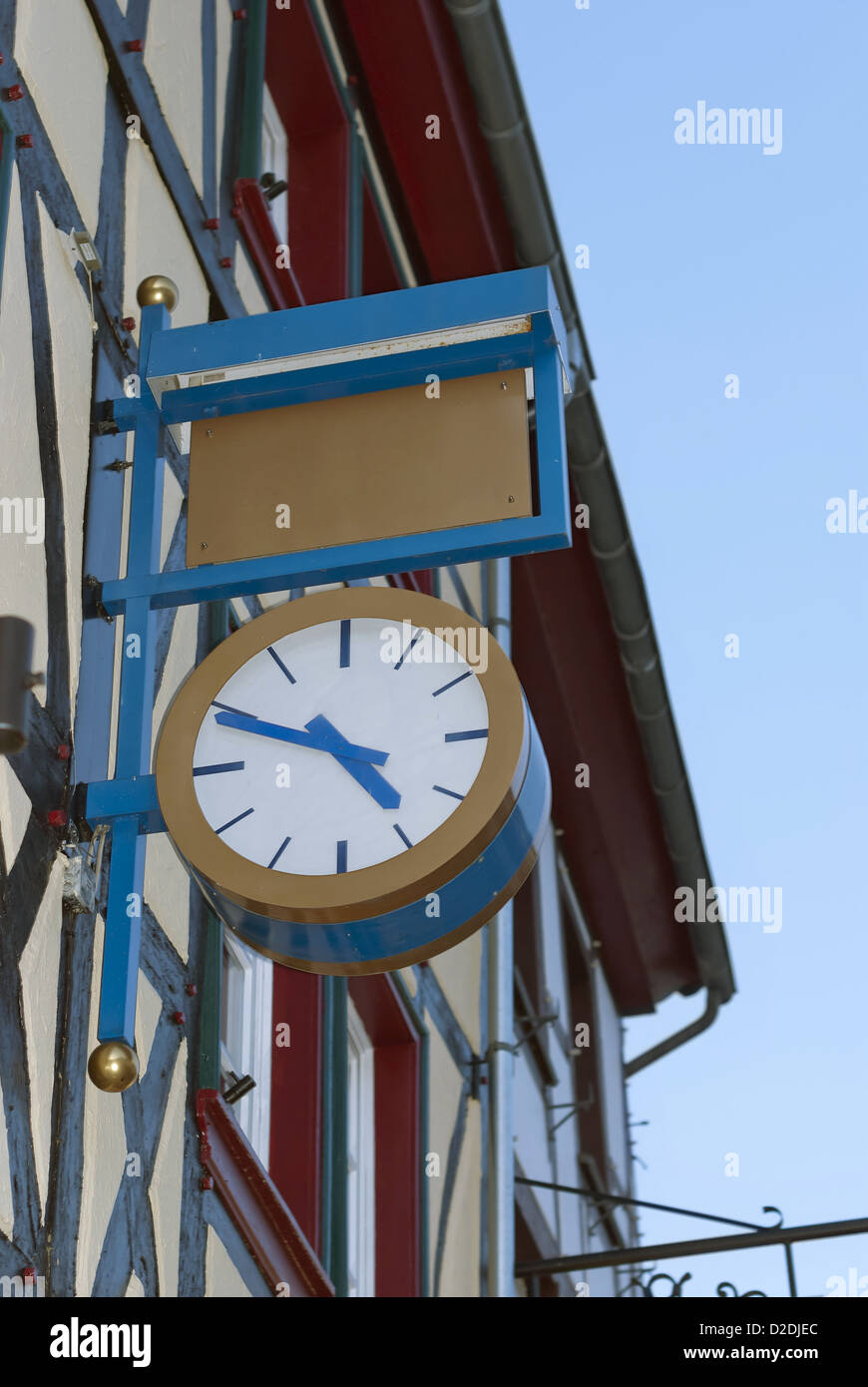Clock outside of the old house in a German town Stock Photo - Alamy
