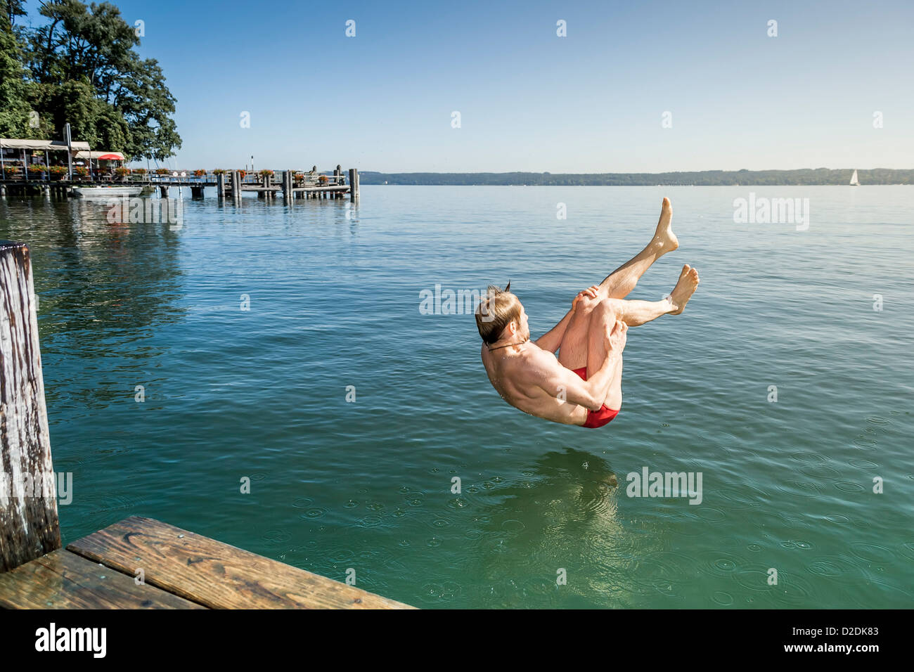 Person jumping into a lake hi-res stock photography and images - Alamy