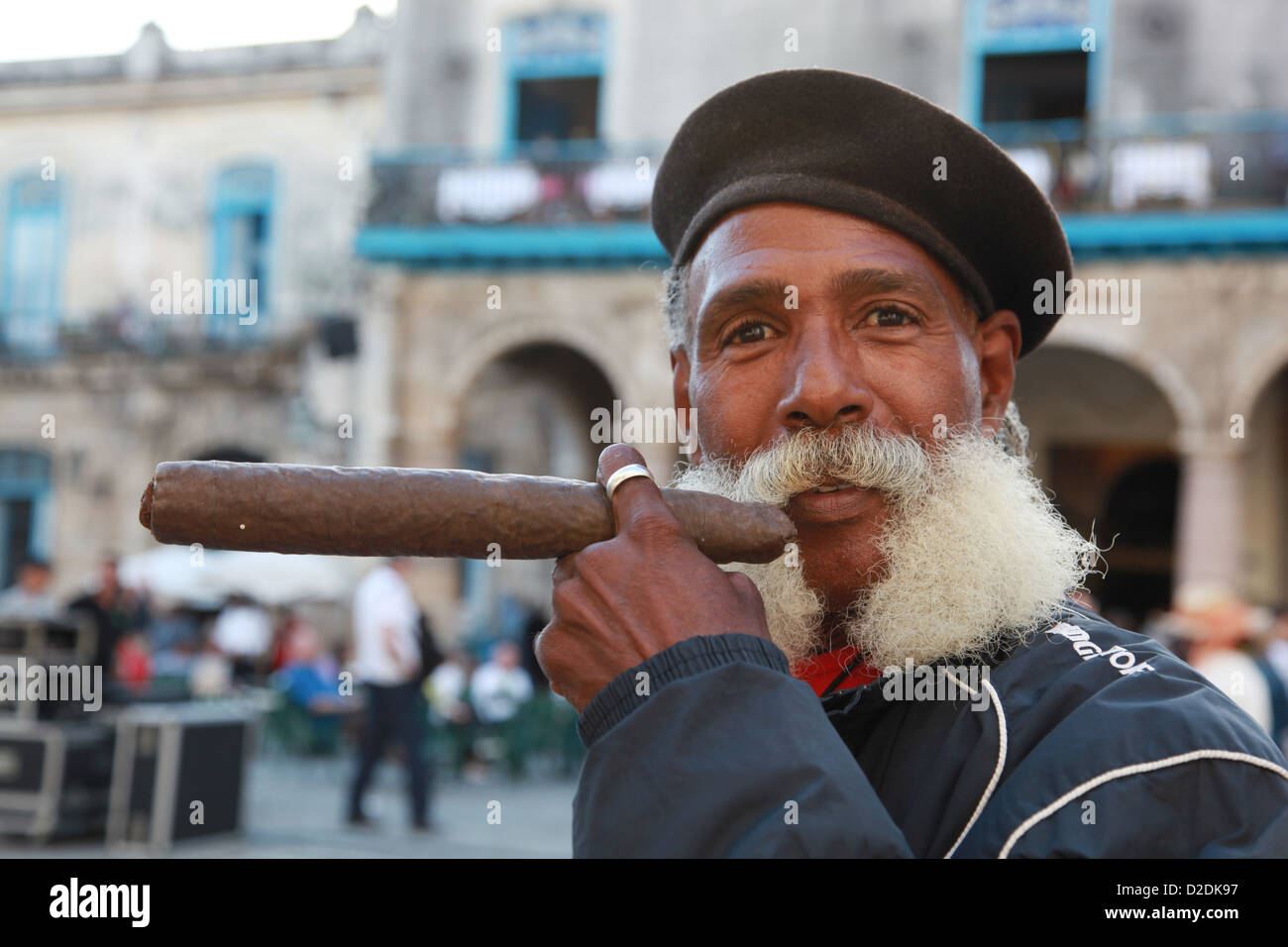 Cuban man smoking a cigar Stock Photo - Alamy