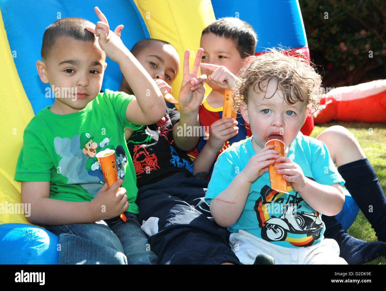 Children eating ice lollies Stock Photo - Alamy