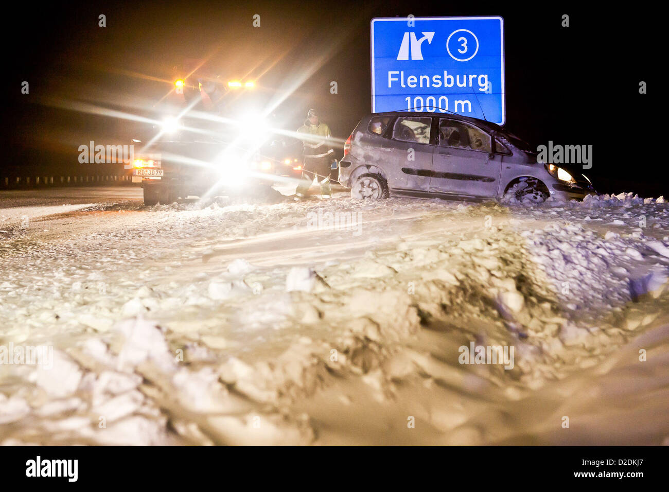 A car sits on a snow-covered Autobahn 7 in Flensburg, Germany, 20 ...
