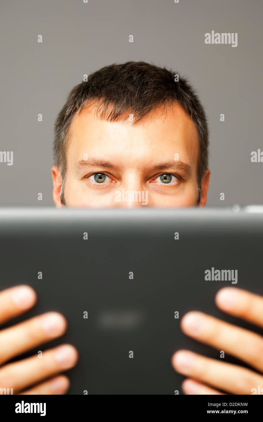 An image of a handsome business man reading his tablet pc Stock Photo ...
