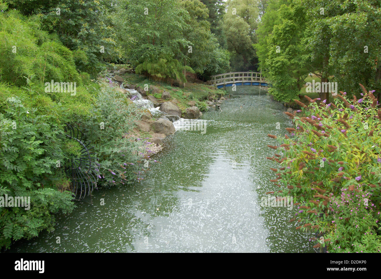 Waterfall and footbridge in Regents Park in London, England Stock Photo ...