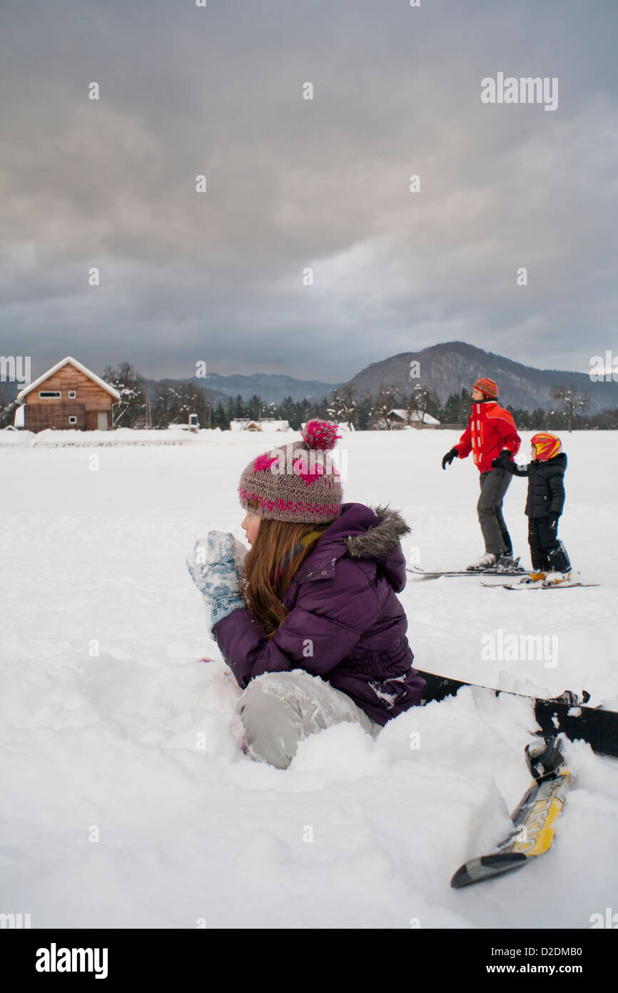 Girl resting on the snow Stock Photo - Alamy