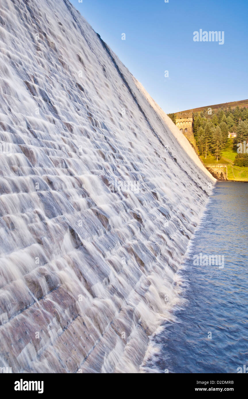 Dam wall with water overflowing Derwent reservoir Derbyshire Peak ...