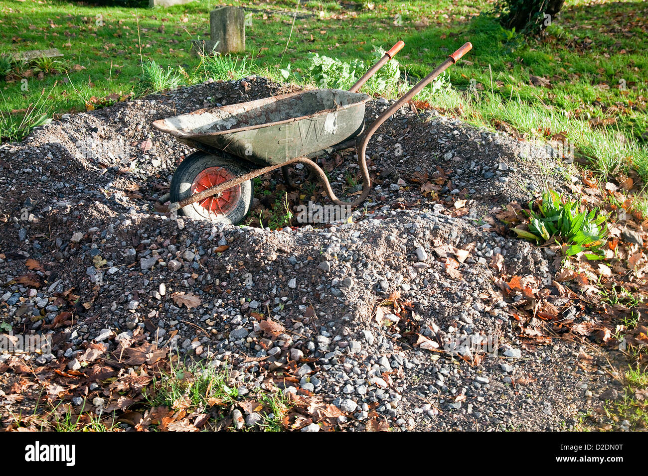 Wheelbarrow and rubble Stock Photo - Alamy