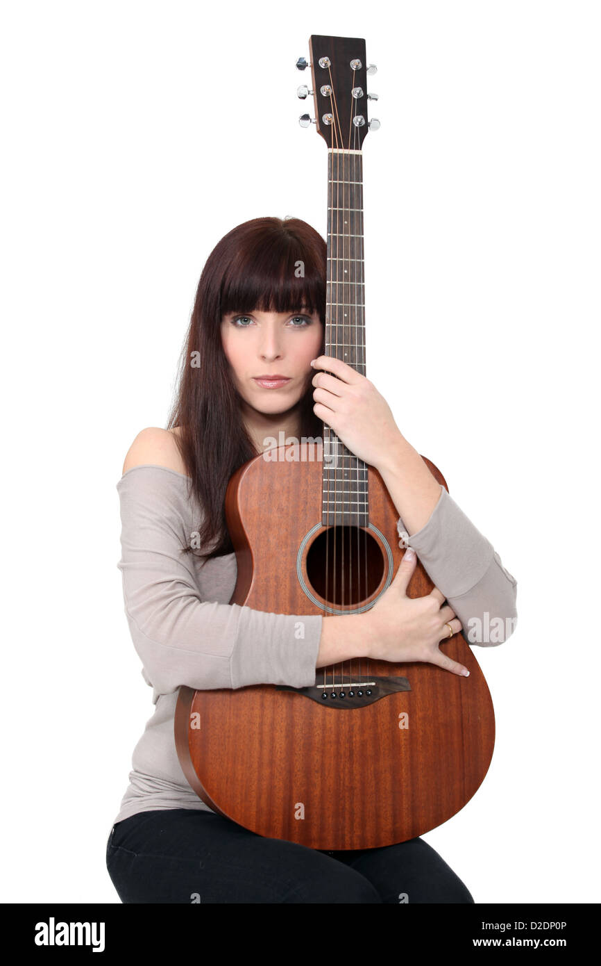 Brunette woman with guitar Stock Photo - Alamy