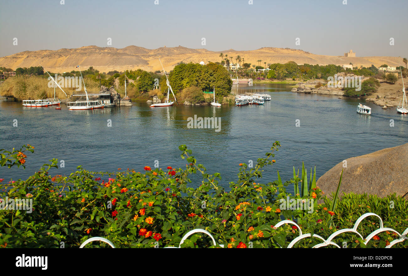 VIEW OF THE ISLANDS AT ASWAN WITH THE AGA KHAN MAUSOLEUM ON THE HILLS ...