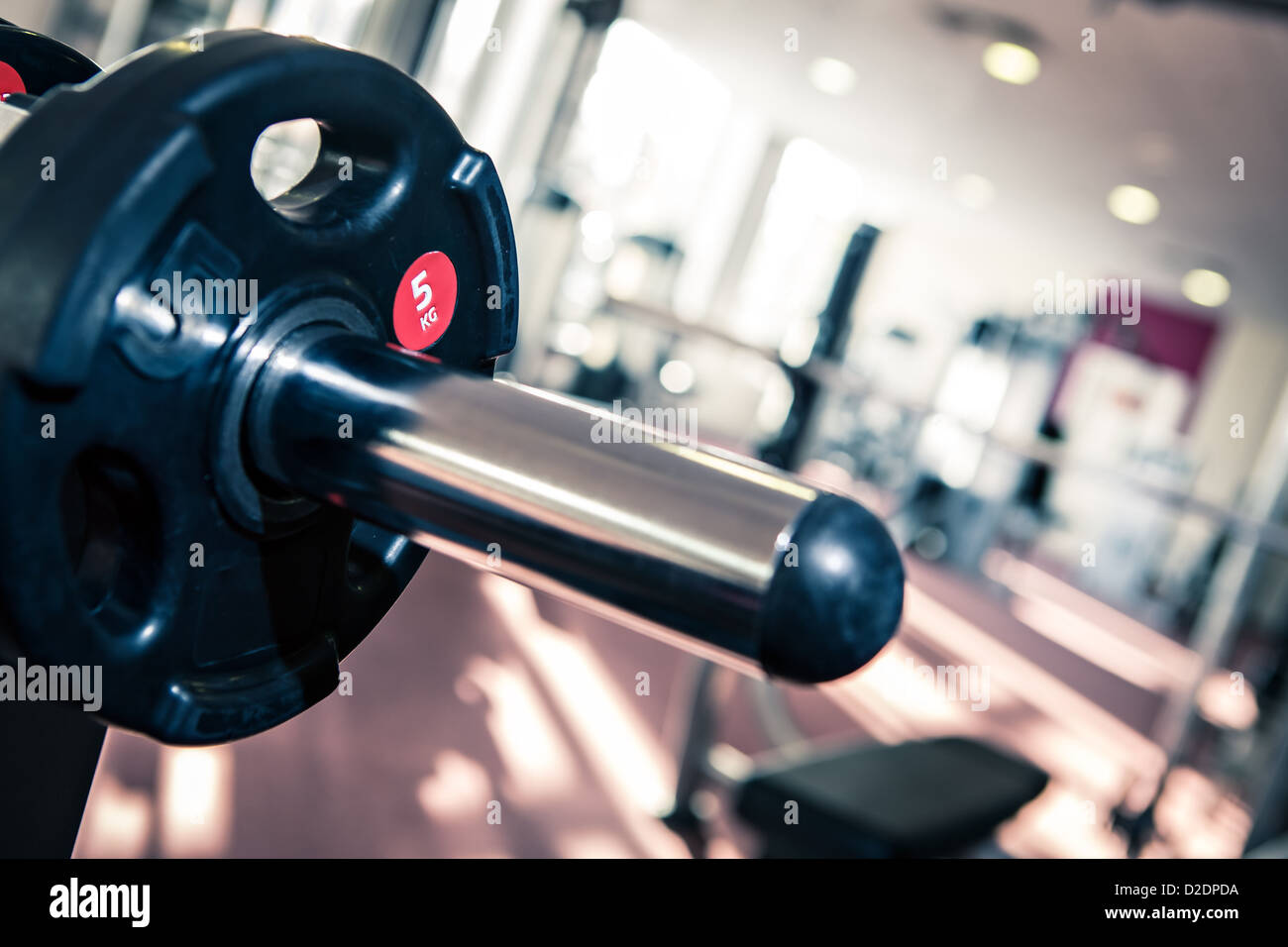 diverse equipment and machines at the gym room Stock Photo - Alamy